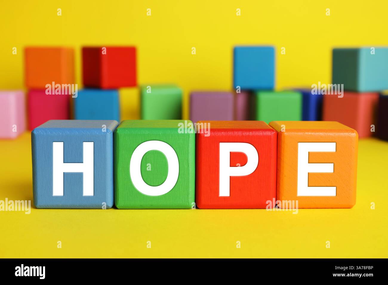 Word Hope made of colorful cubes on yellow background Stock Photo - Alamy