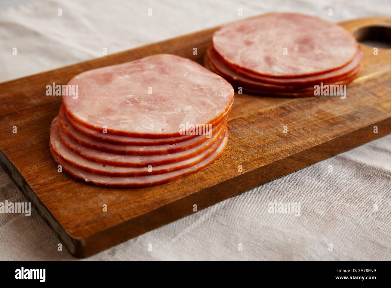 Organic Smoked Cold Cuts Deli Meat Ham on a wooden board, side view ...
