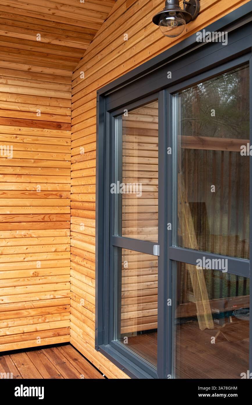 modern modular house in the forest. facade of wooden house Stock Photo ...