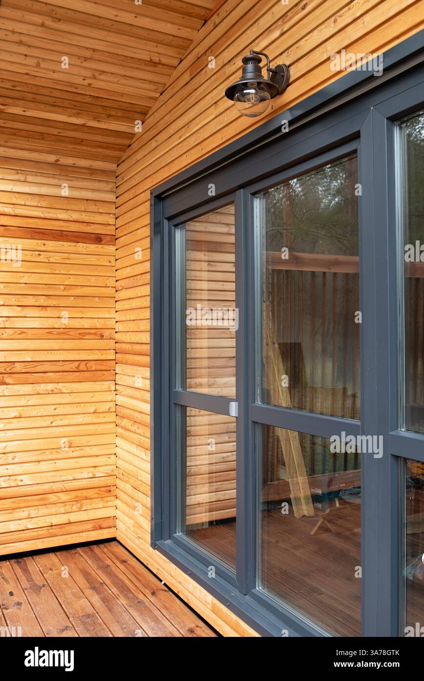 modern modular house in the forest. facade of wooden house Stock Photo ...