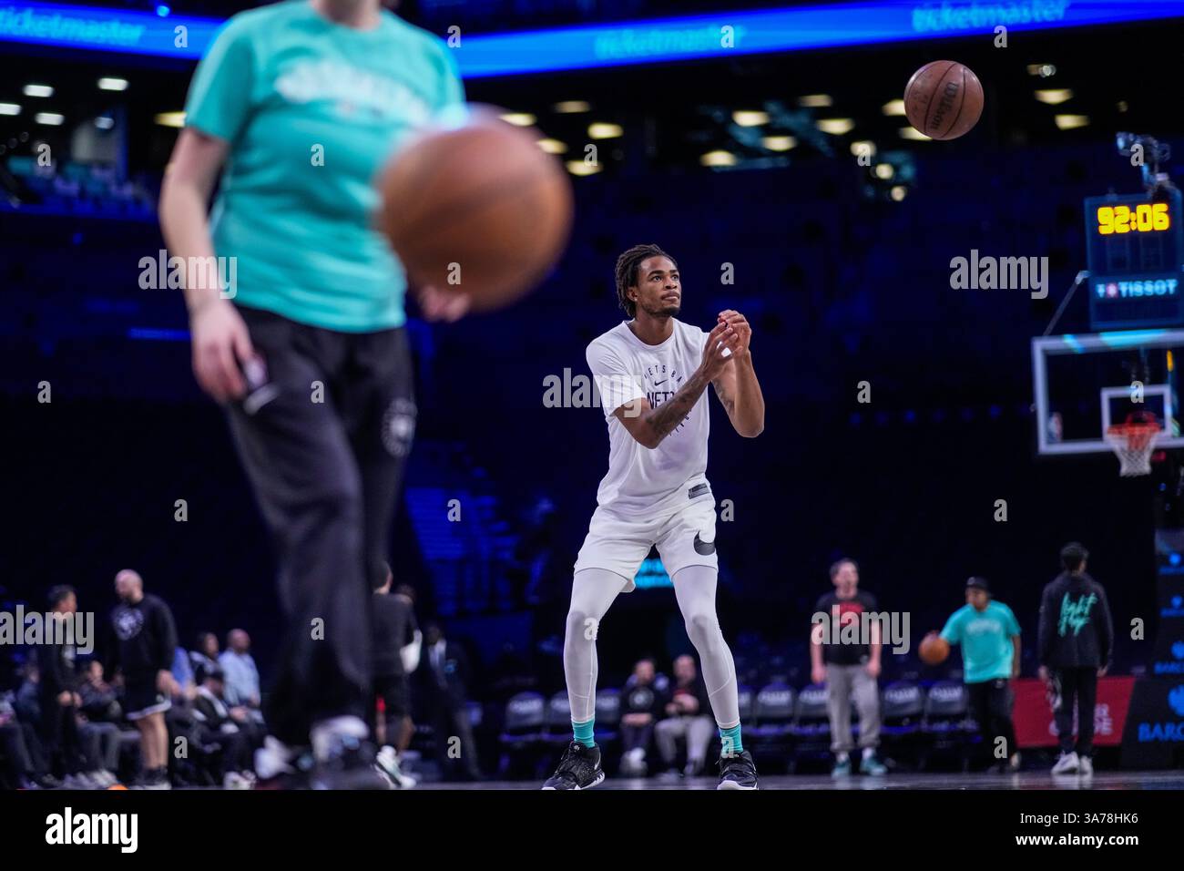 Brooklyn Nets center Nic Claxton warms up before an NBA basketball game ...