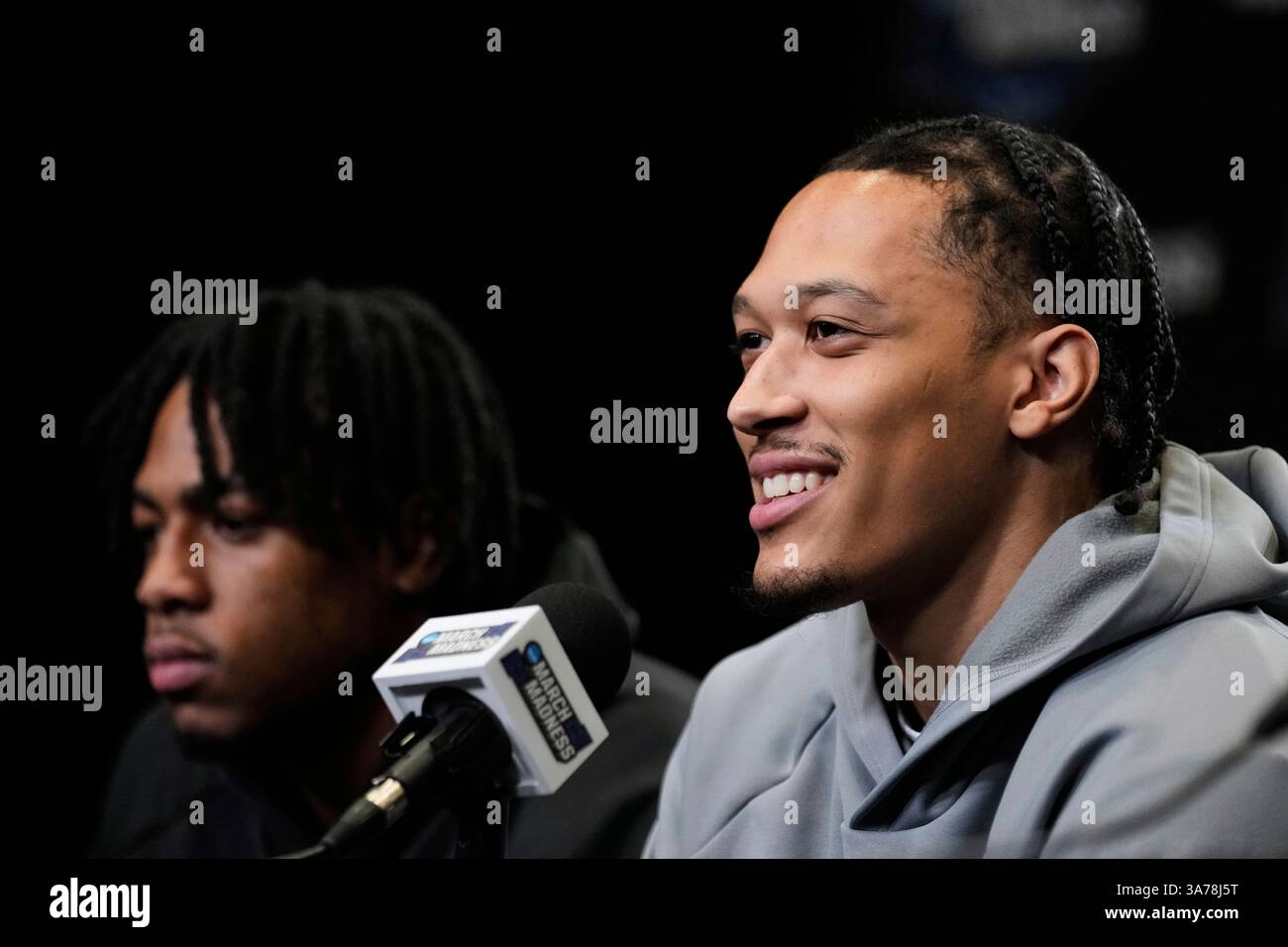 Texas Tech forward Darrion Williams, right, speaks to reporters during ...