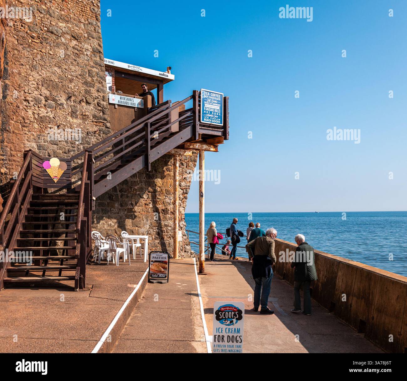 The cliff walkway on Sidmouth sea front with a refreshment kiosk ...