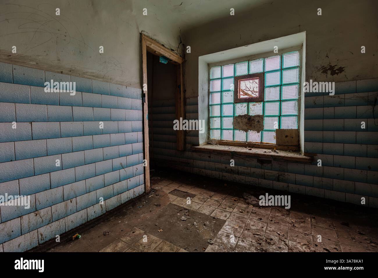 Corridor with block glass window in abandoned building Stock Photo - Alamy