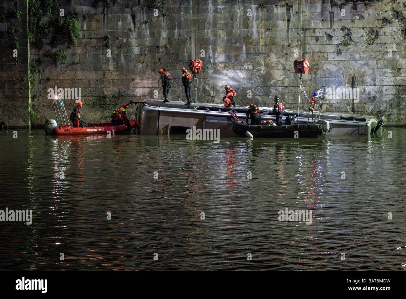 Turin, Italy. 26 March 2025. Firefighters work during the recovery ...