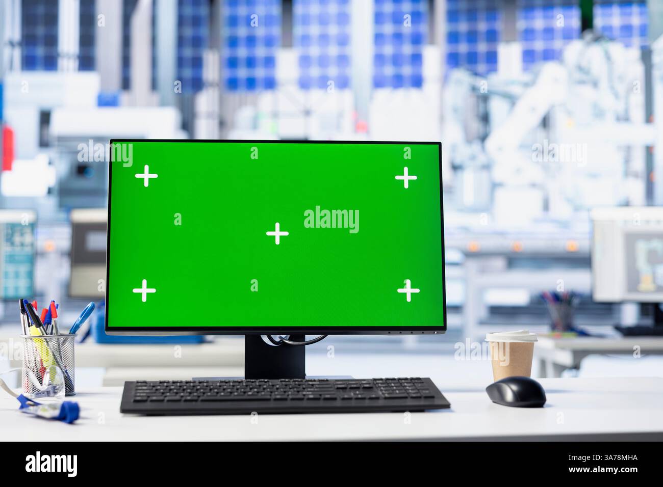 Isolated screen PC in photovoltaics factory used to monitor performance of robot arms ...