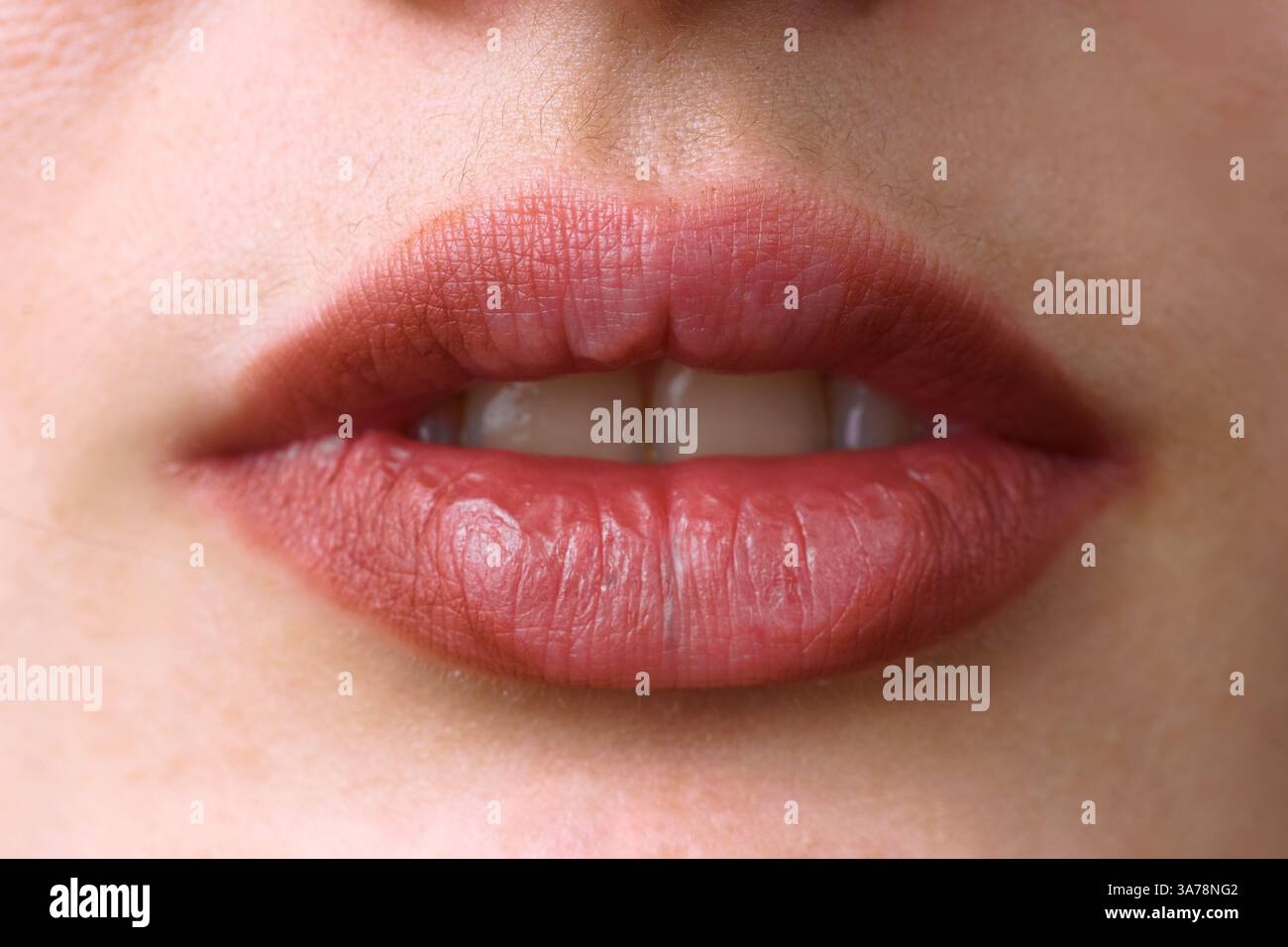 Close up of a woman's mouth, slightly parted, showcasing perfectly ...