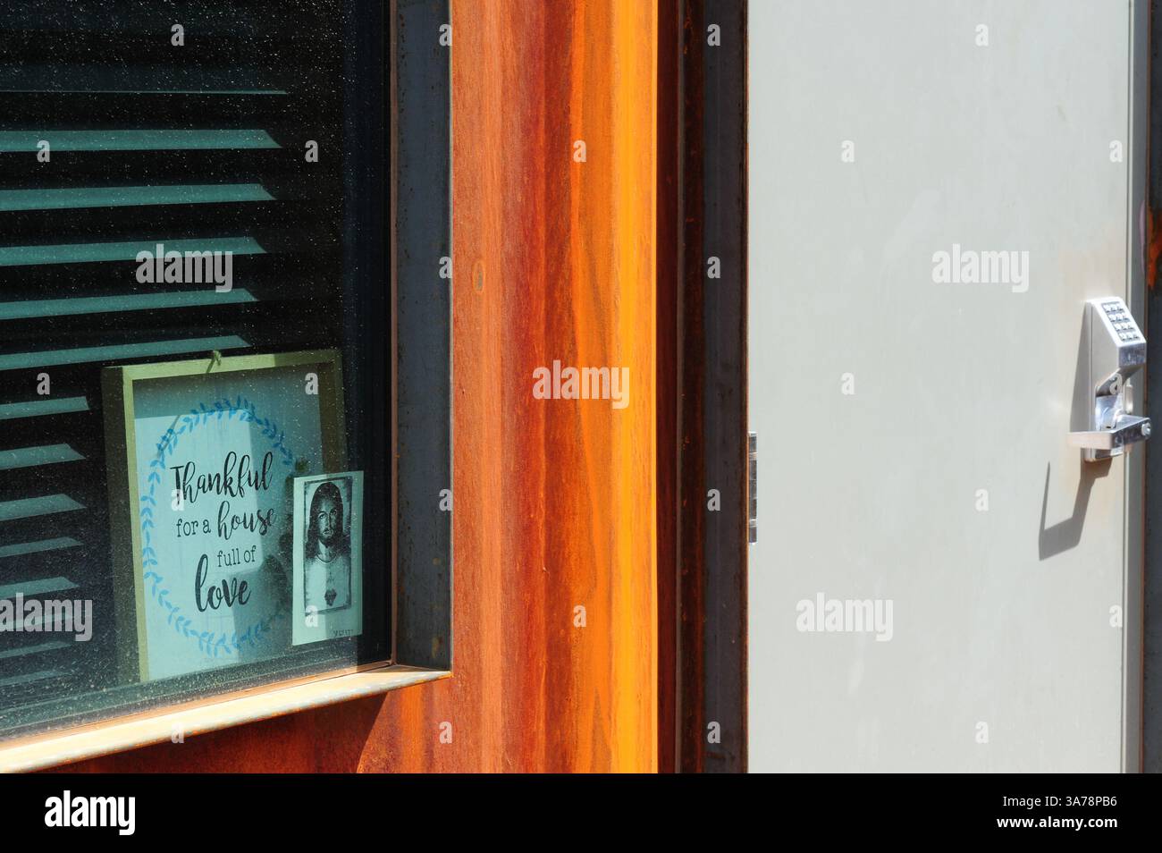 Phoenix, Arizona, USA. 26th Mar, 2025. A framed message and a religious ...