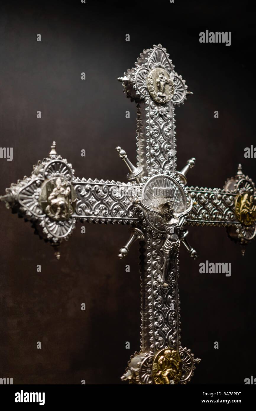 Silver crucifix in medieval Gothic style exposed with a background in ...