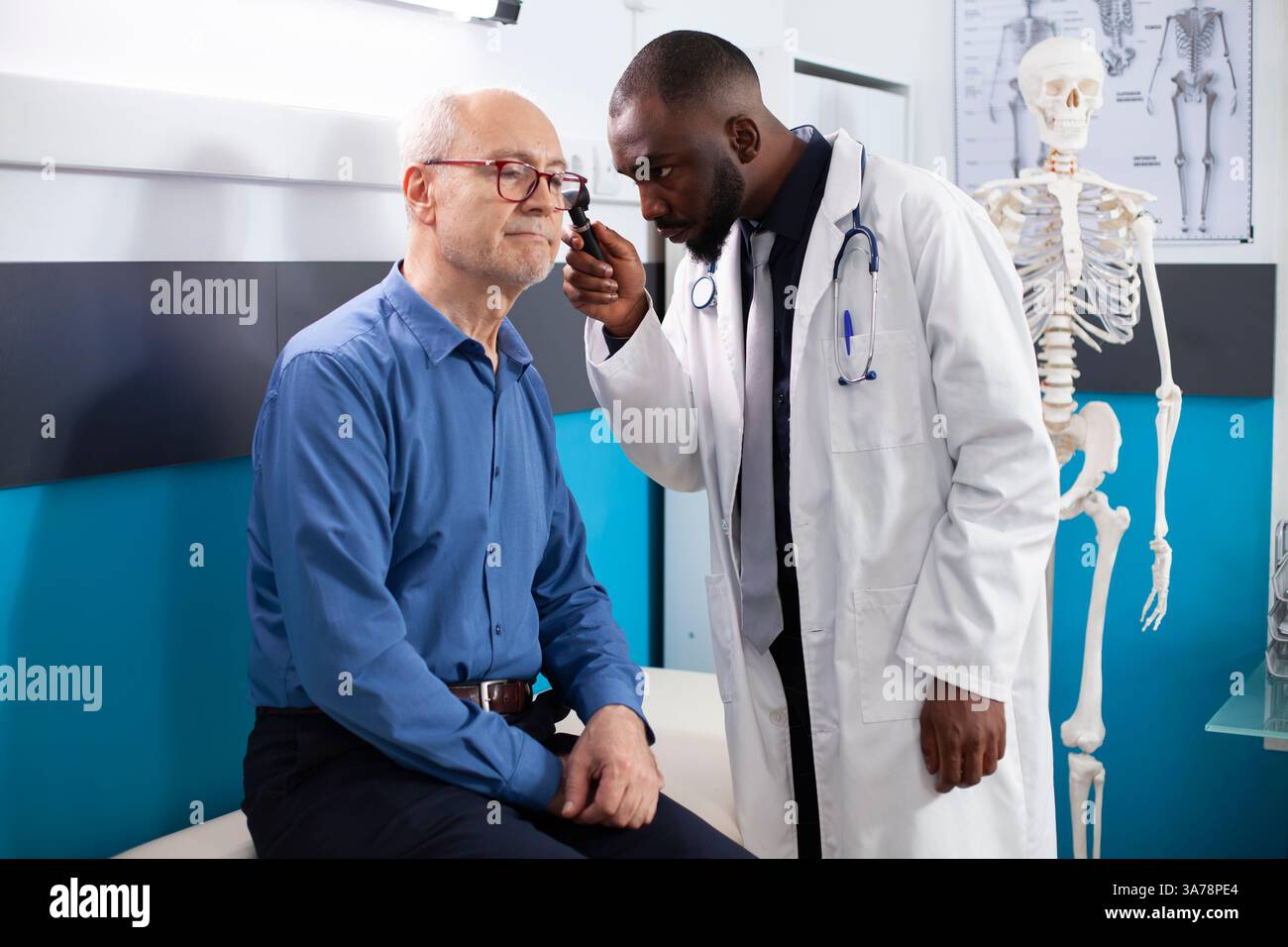 African american ent specialist doing ear examination on elderly man ...