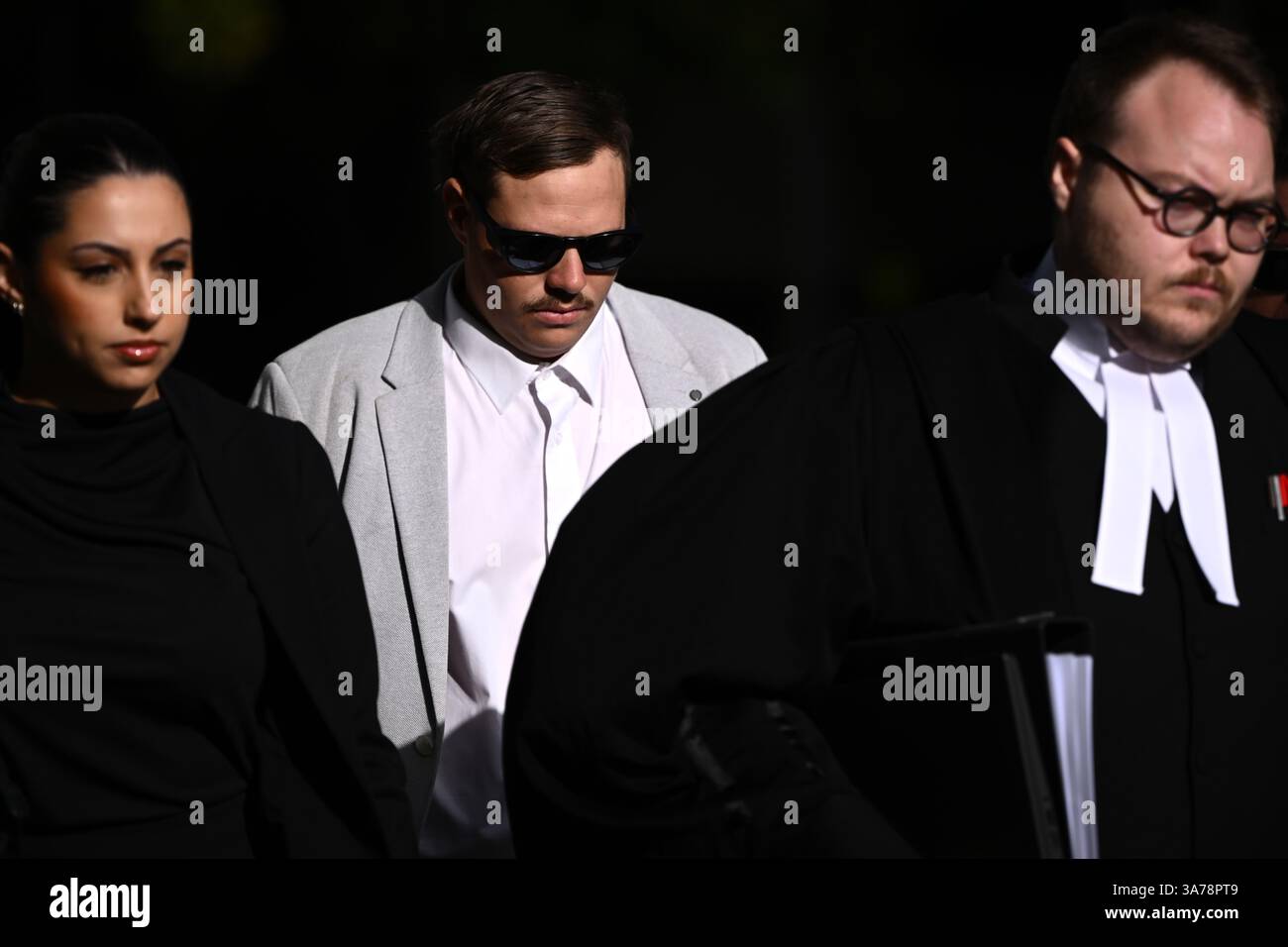 Quinn McPherson (centre) arrives at the Supreme Court of Victoria in Melbourne, Thursday, March ...