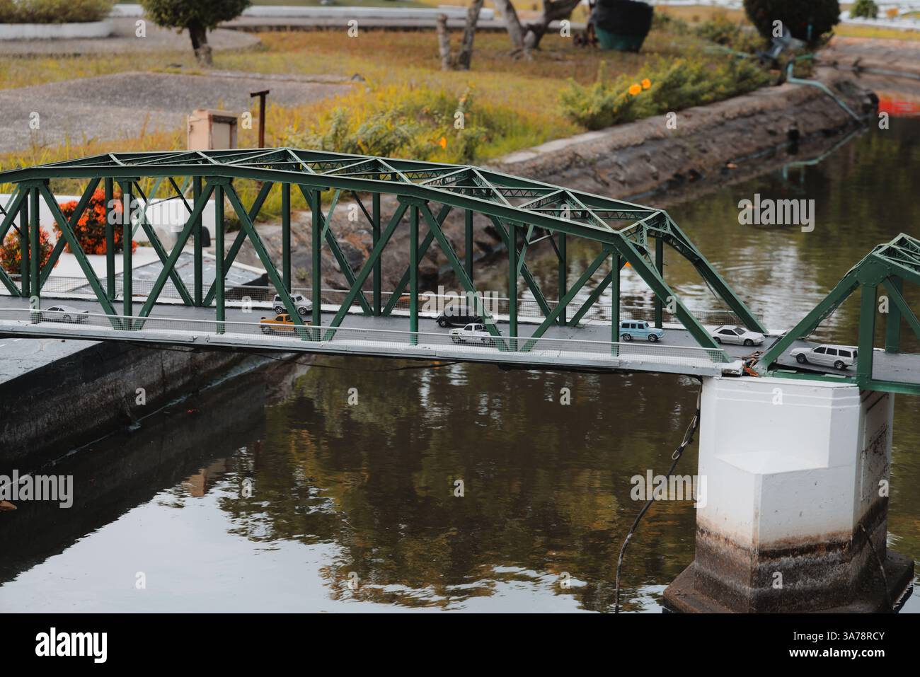 The Green Bridge stretches gracefully over the waterway, located within ...