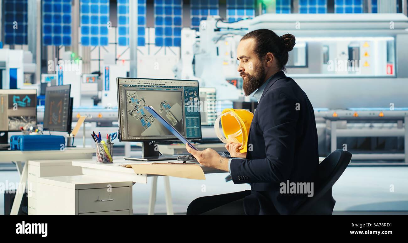Photovoltaics factory industrial production manager looking over ...