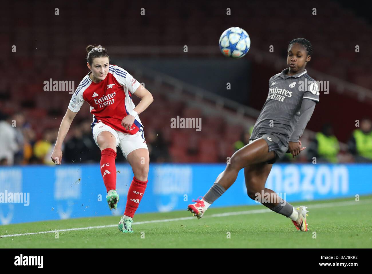Emily Fox of Arsenal Women crosses the ball while being closed down by ...