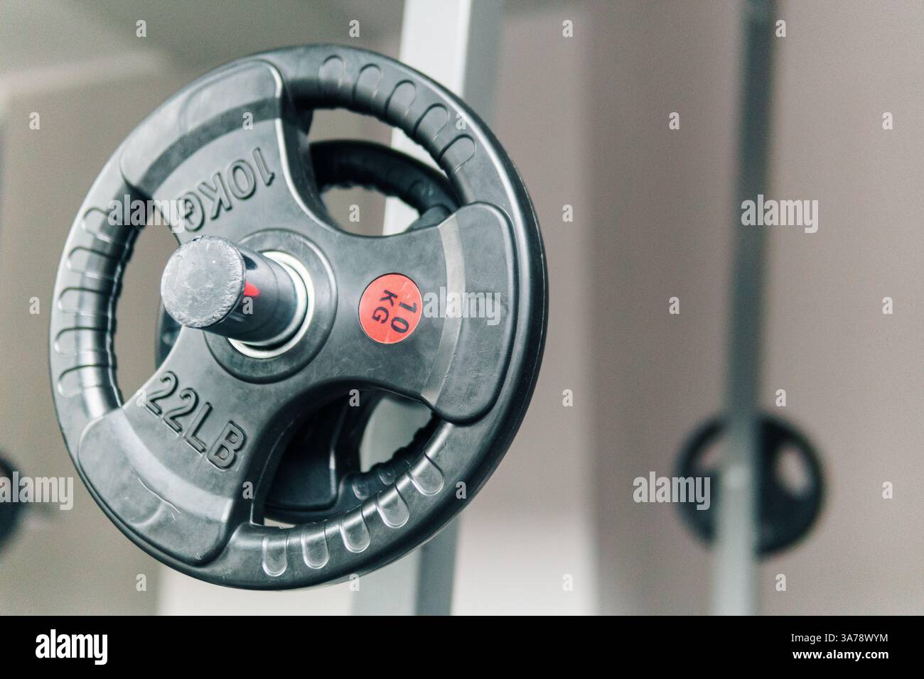 Close-up view of dumbbells, black circular weights, in a gym Stock ...