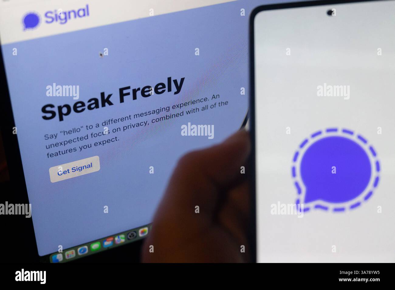 In this photo illustration, a mobile device displays the Signal company ...