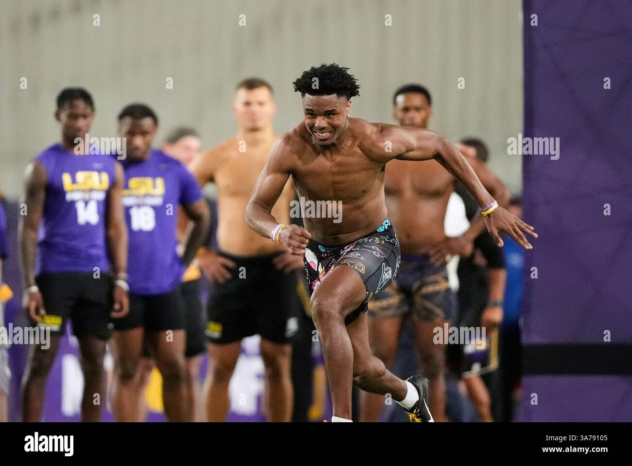 LSU wide receiver Kyren Lacy runs through drills during the school's ...