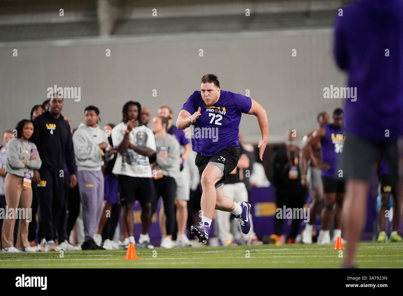 LSU offensive lineman Garrett Dellinger runs through drills during the ...