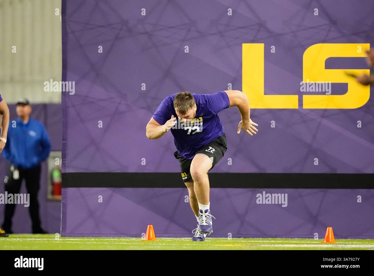 LSU offensive lineman Garrett Dellinger runs through drills during the ...