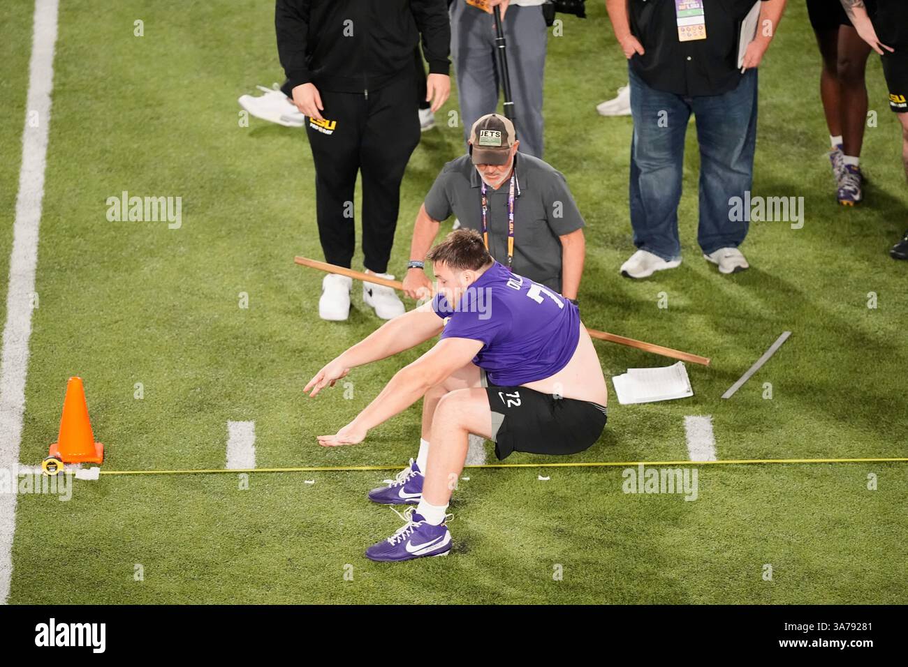 LSU offensive lineman Garrett Dellinger runs through drills during the ...