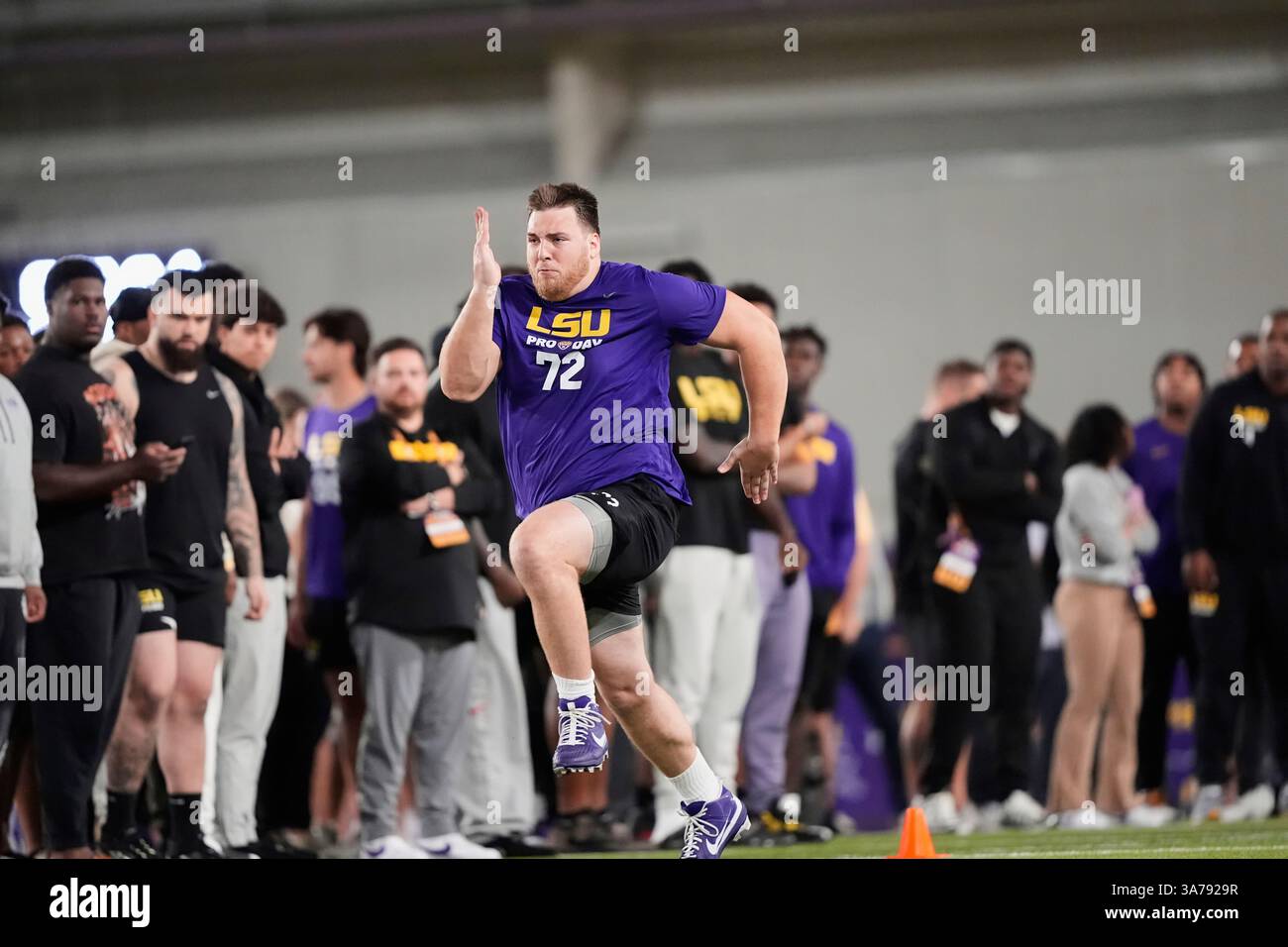 LSU offensive lineman Garrett Dellinger runs through drills during the ...