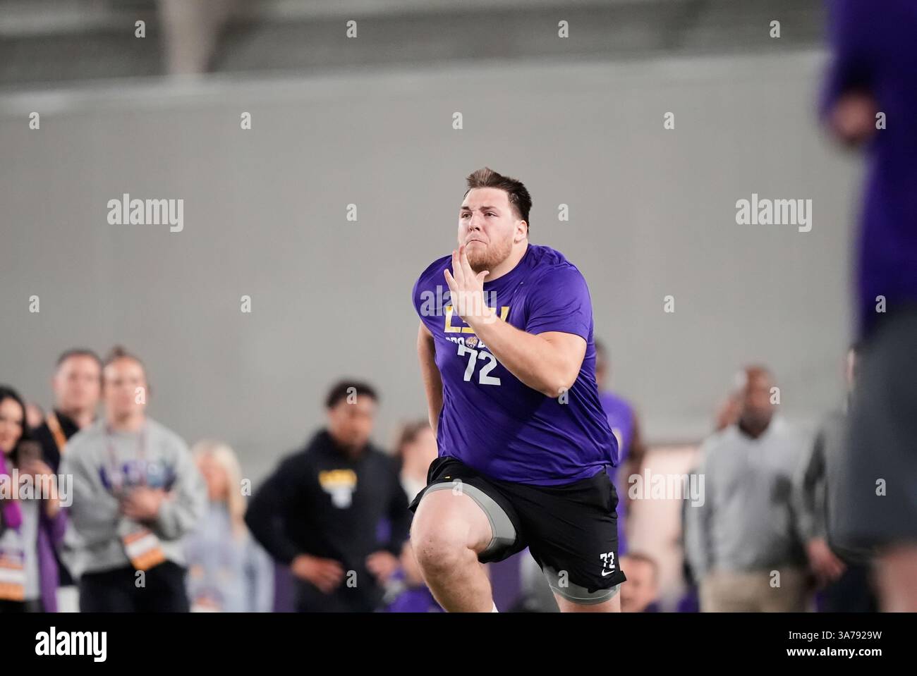 LSU offensive lineman Garrett Dellinger runs through drills during the ...