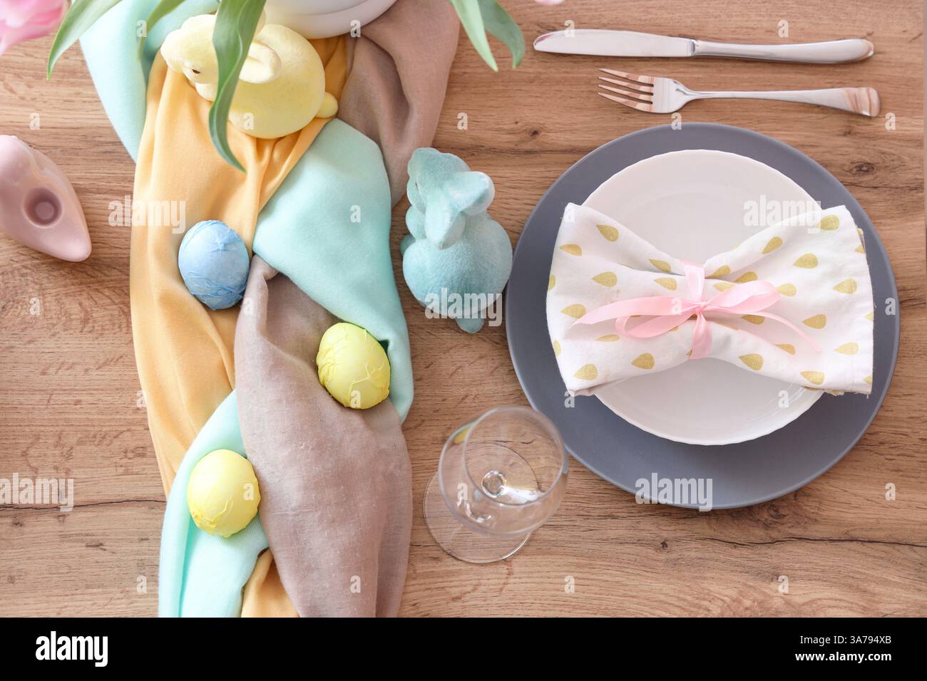Beautiful Easter table setting with flowers, cutlery and painted eggs Stock Photo - Alamy