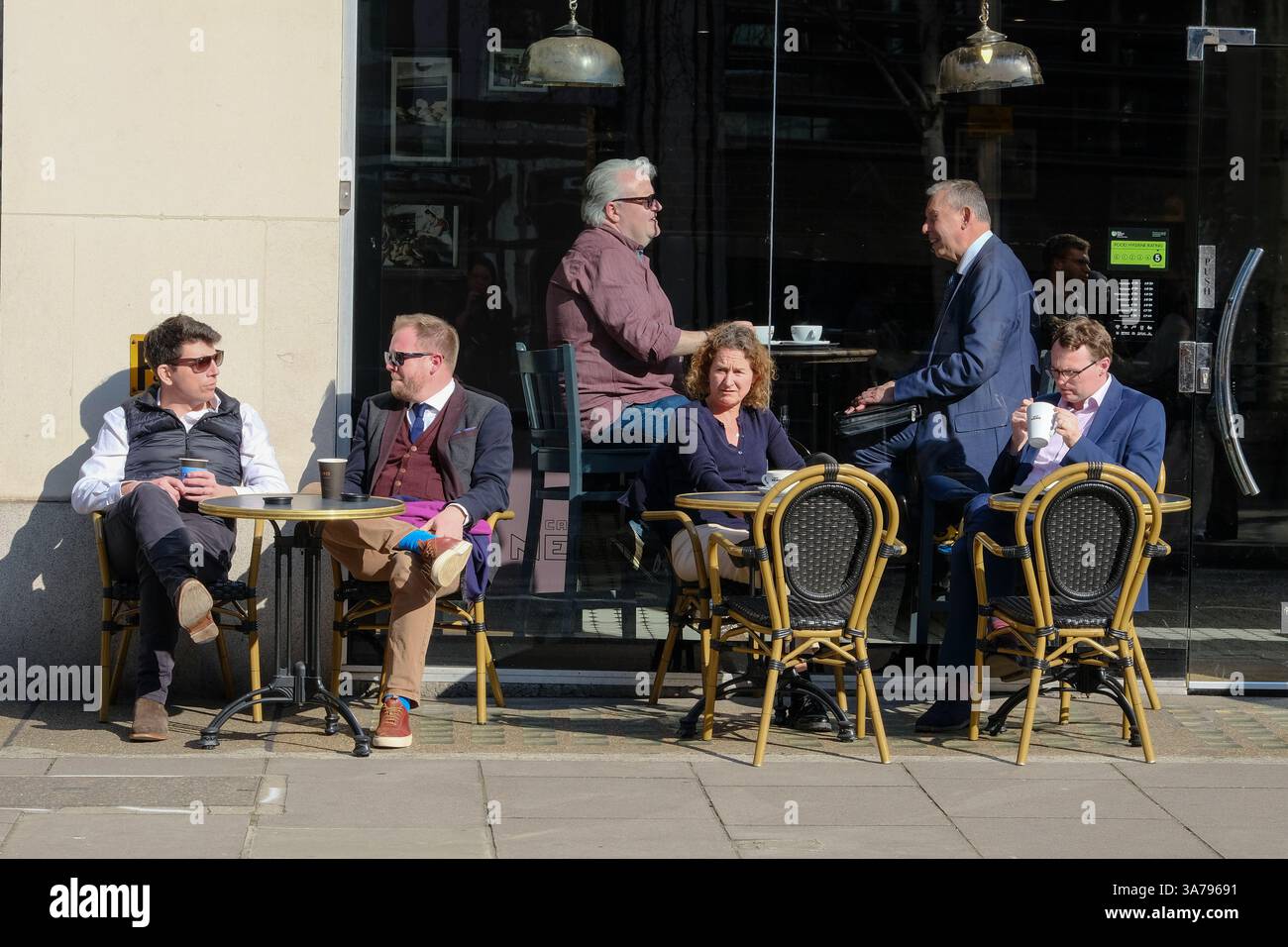 People socialise and enjoy the sunny weather at a Cafe Nero in ...