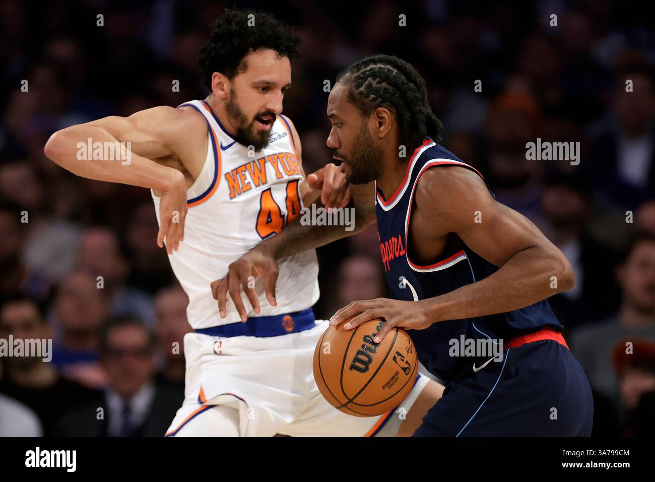 LA Clippers forward Kawhi Leonard drives into New York Knicks guard ...