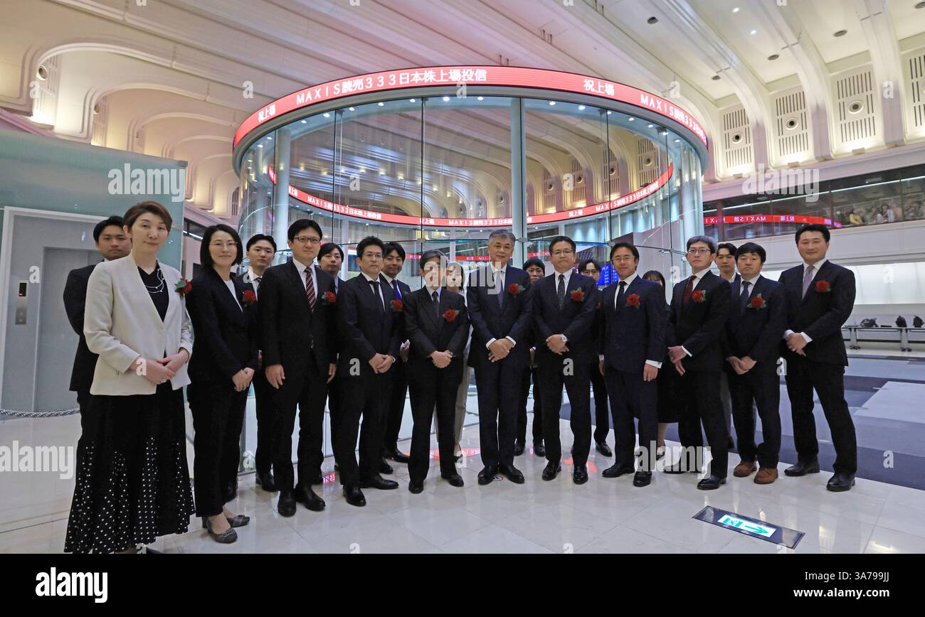 Mitsubishi UFJ Asset Management and Yomiuri Shimbun officials pose for a commemorative ...