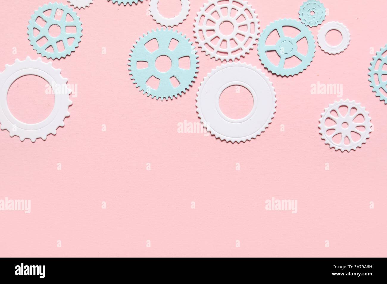 Different paper gears on pink background Stock Photo - Alamy