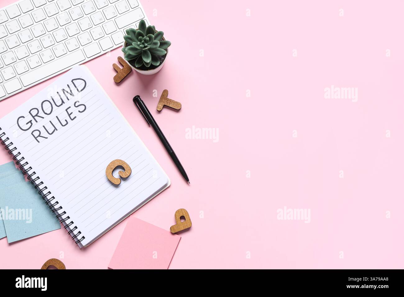 Notebook with text GROUND RULES, sticky notes and computer keyboard on ...