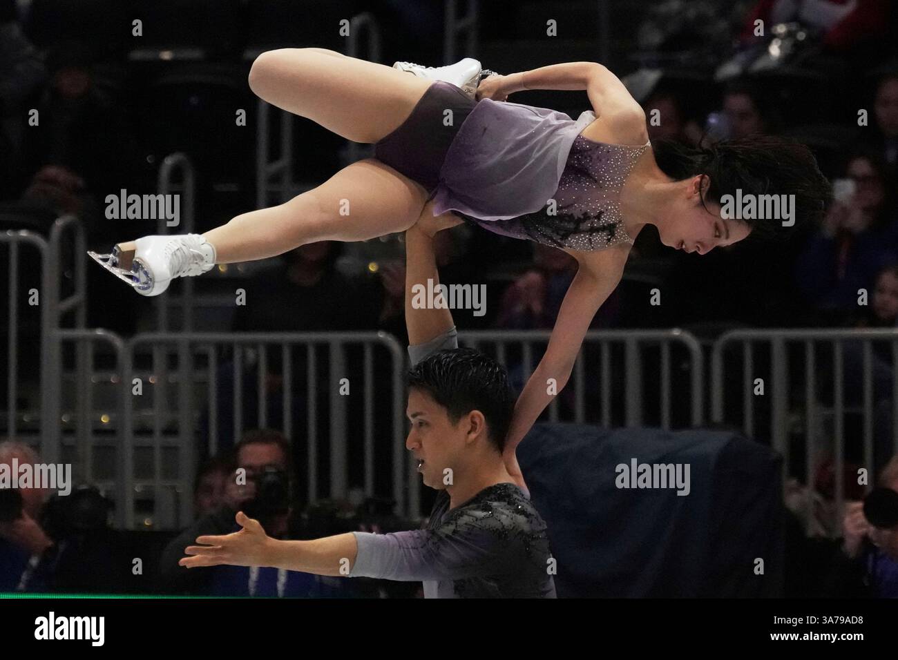 Riku Miura and Ryuichi Kihara, of Japan, perform during their pairs ...