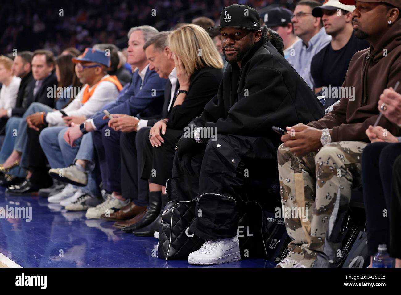 Boxer Floyd Mayweather Jr. looks on during the first half of an NBA ...
