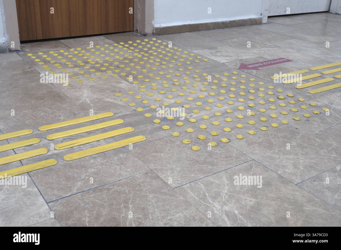 Textured surface markings guide safe movement in public space Stock ...