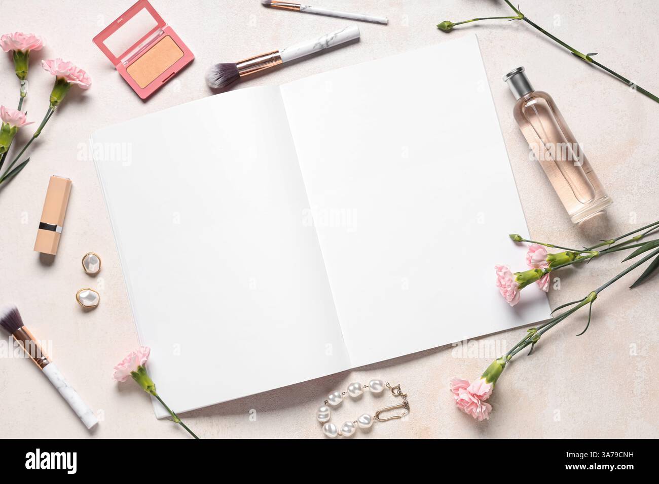 Blank fashion magazine with flowers, cosmetics and jewellery on white ...