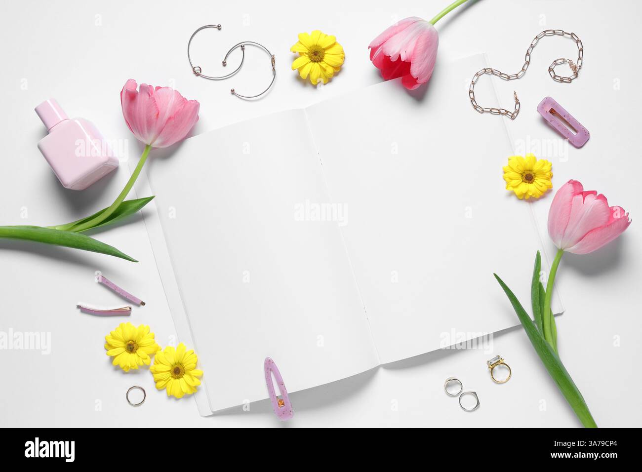 Blank fashion magazine with flowers, cosmetics and jewellery on white ...