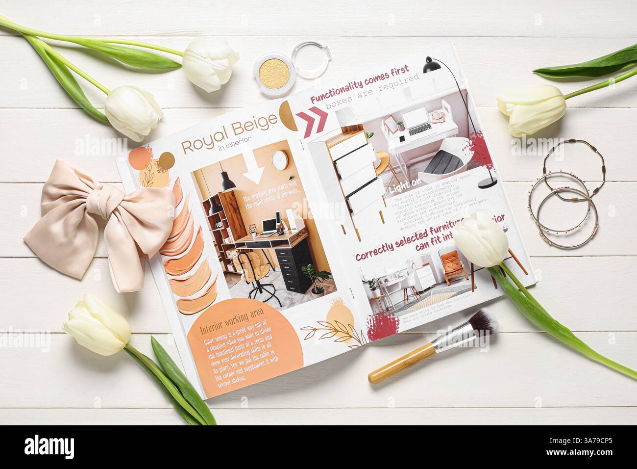 Fashion magazine with flowers and cosmetics on white wooden background ...