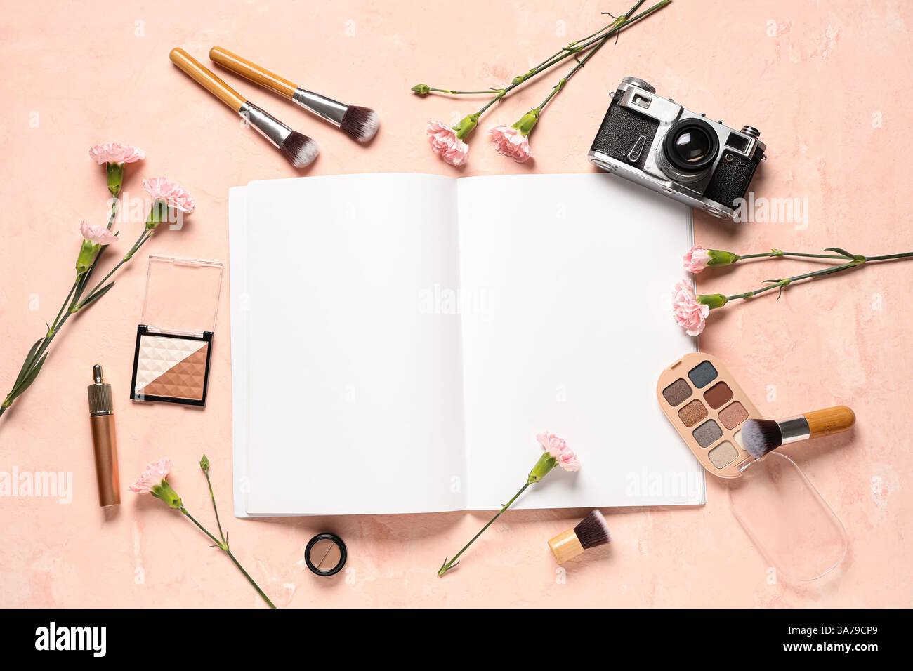 Blank fashion magazine with flowers, cosmetics and photo camera on pink ...