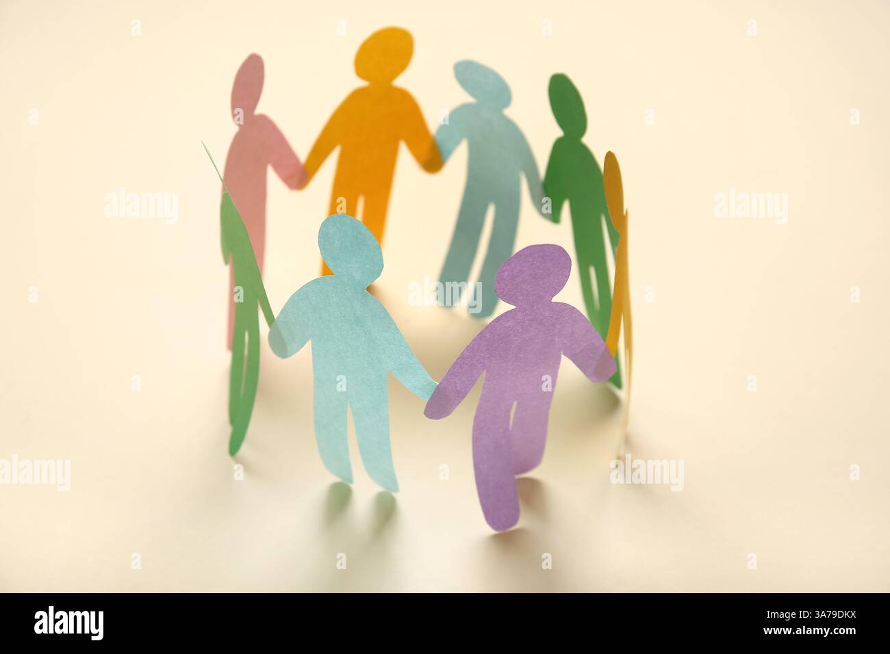 Paper human figures on light background. Inclusion concept Stock Photo ...