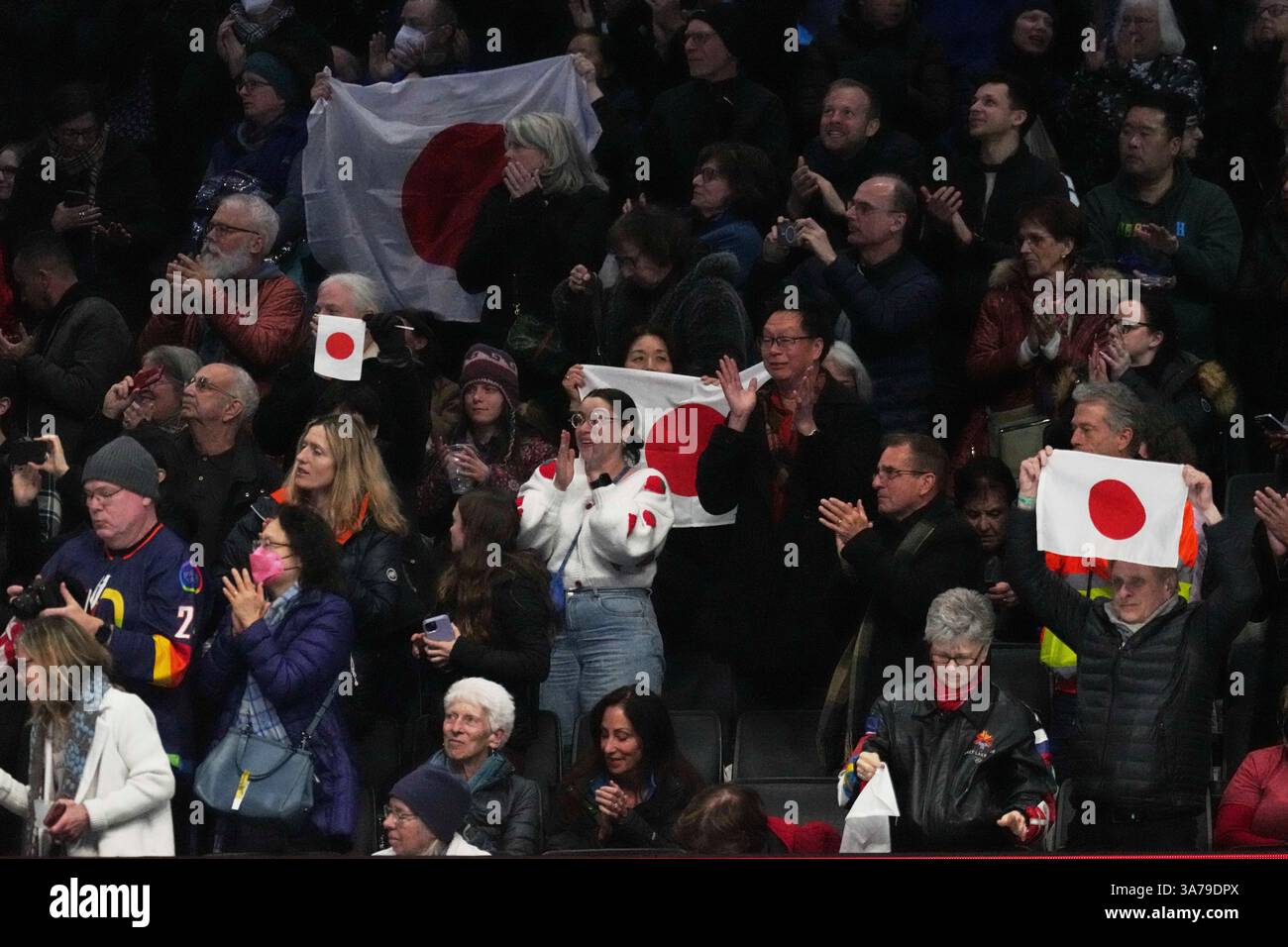Fans support the performance of Riku Miura and Ryuichi Kihara, of Japan ...