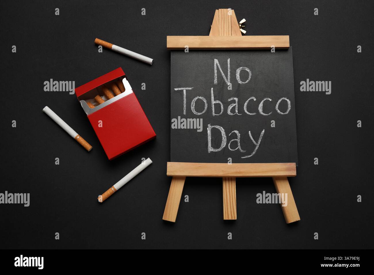 Chalkboard with text NO TOBACCO DAY and cigarettes on black background ...