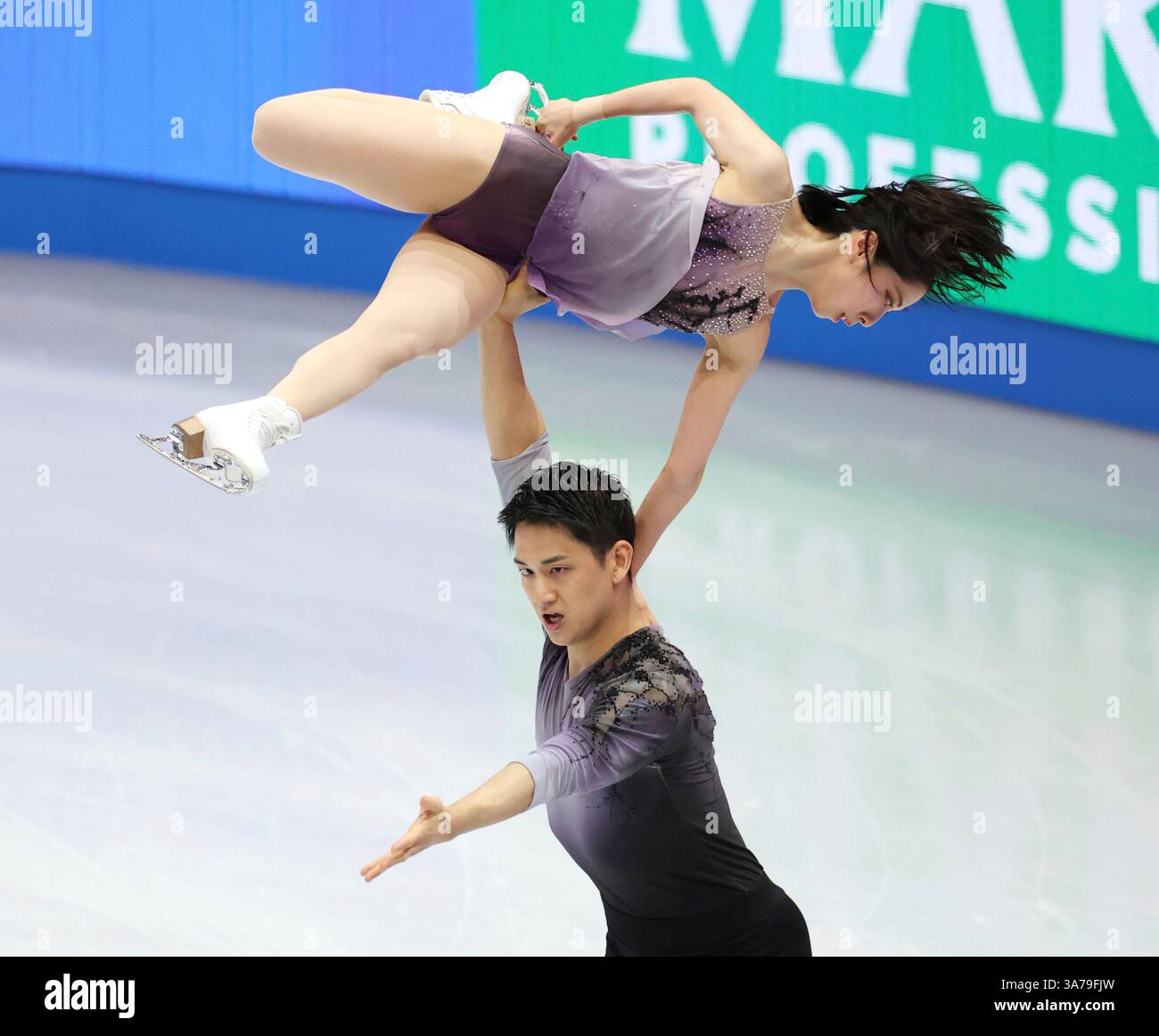 Riku MIURA (L) and Ryuichi KIHARA of Japan perform during the pair's ...
