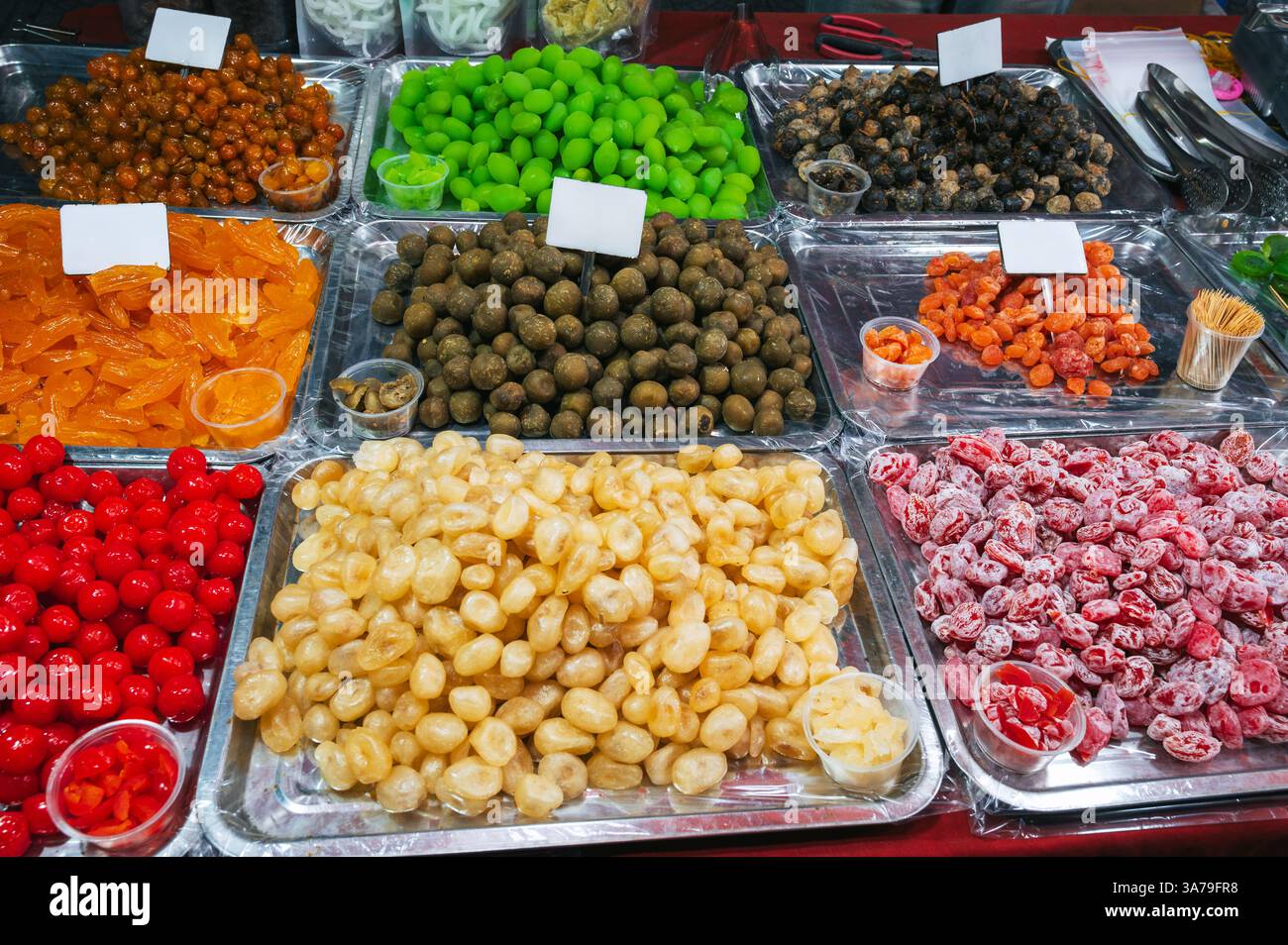 dried fruits and various oriental sweets on the Asian market in Asia in ...