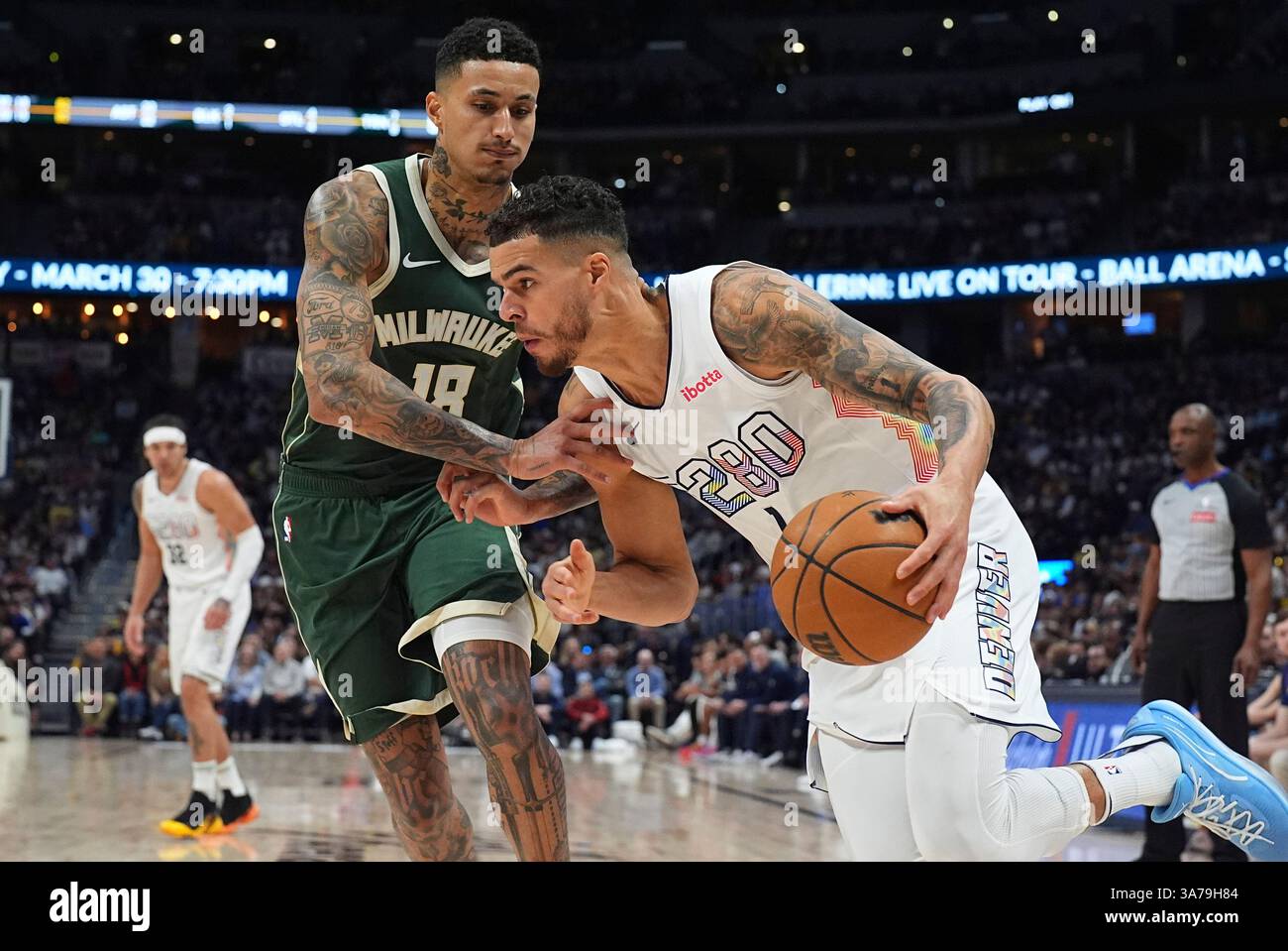 Denver Nuggets forward Michael Porter Jr., right, drives past Milwaukee ...