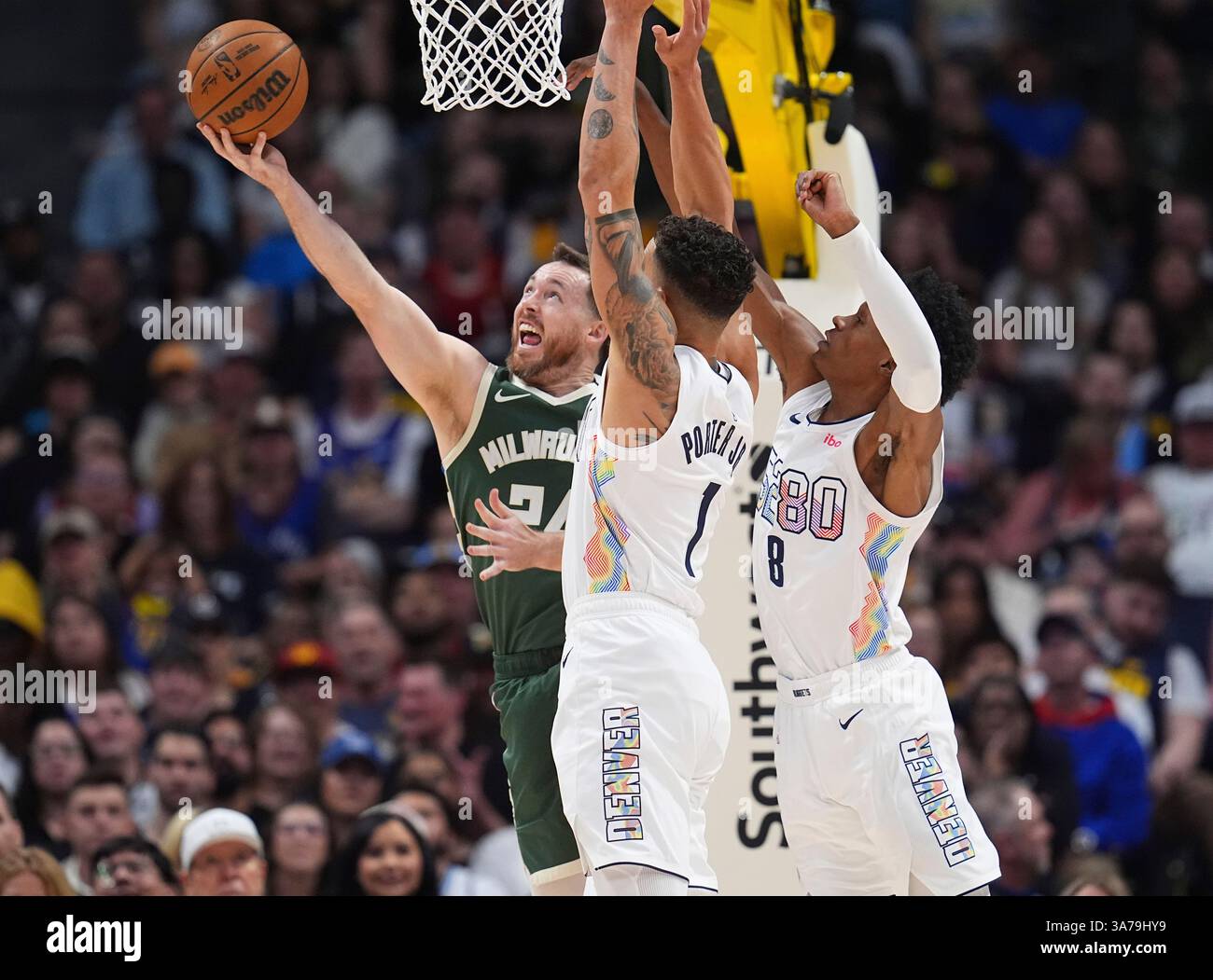 Milwaukee Bucks guard Pat Connaughton, left, goes up for a basket as ...