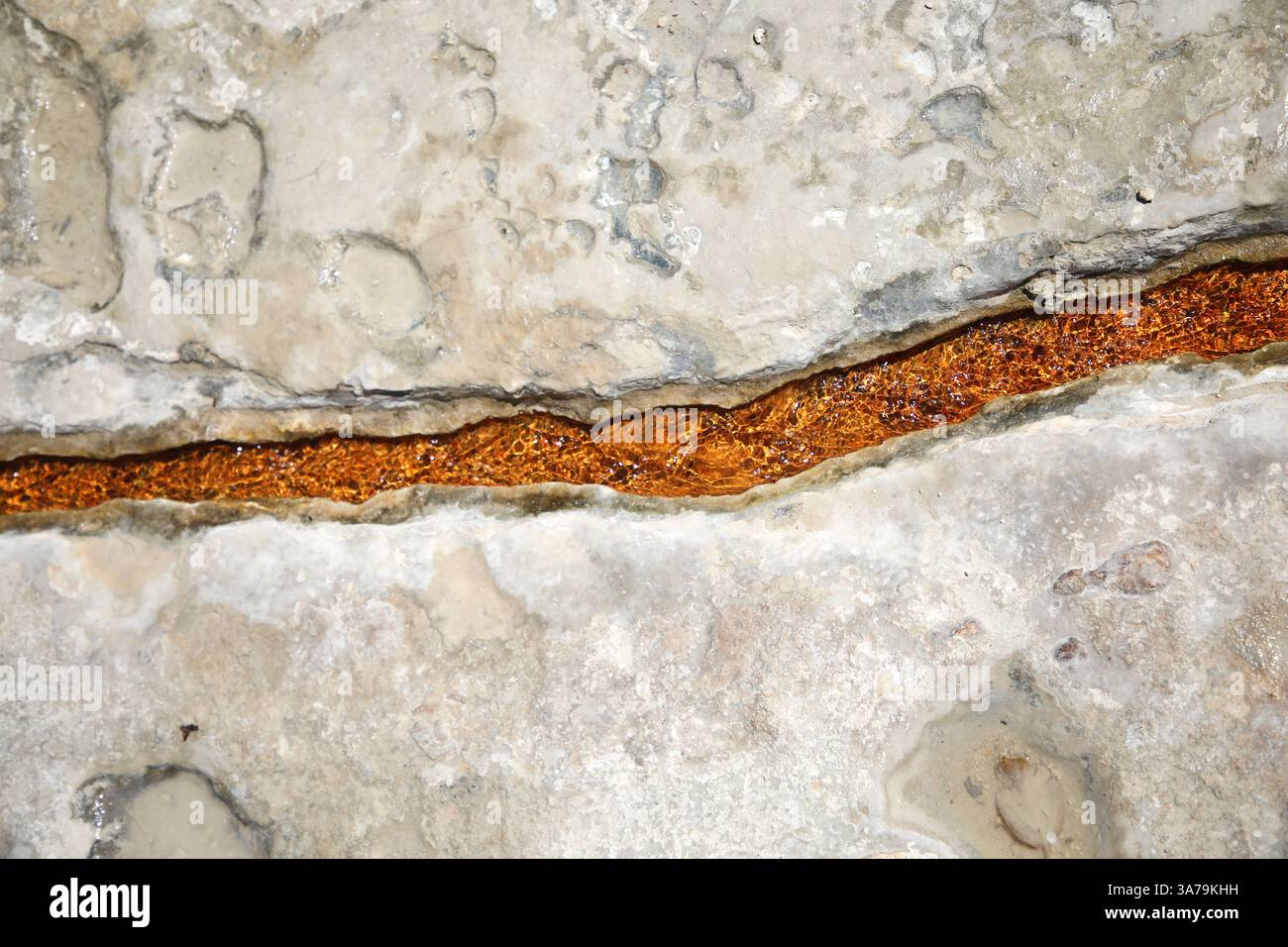 A stream flows through Hierve el Agua, a geological formation. It ...