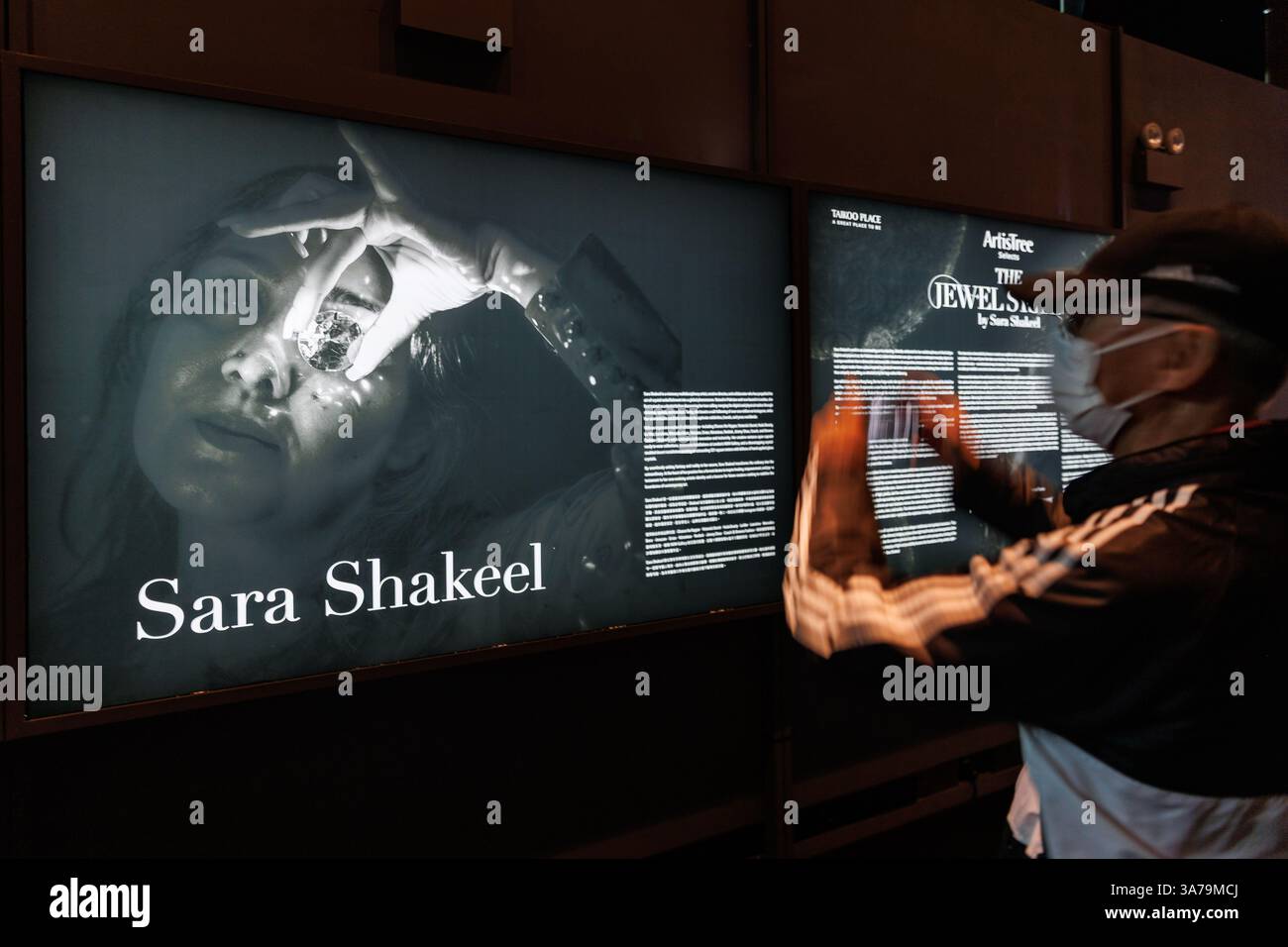 A visitor seen taking a picture using his phone during the Jewel System ...