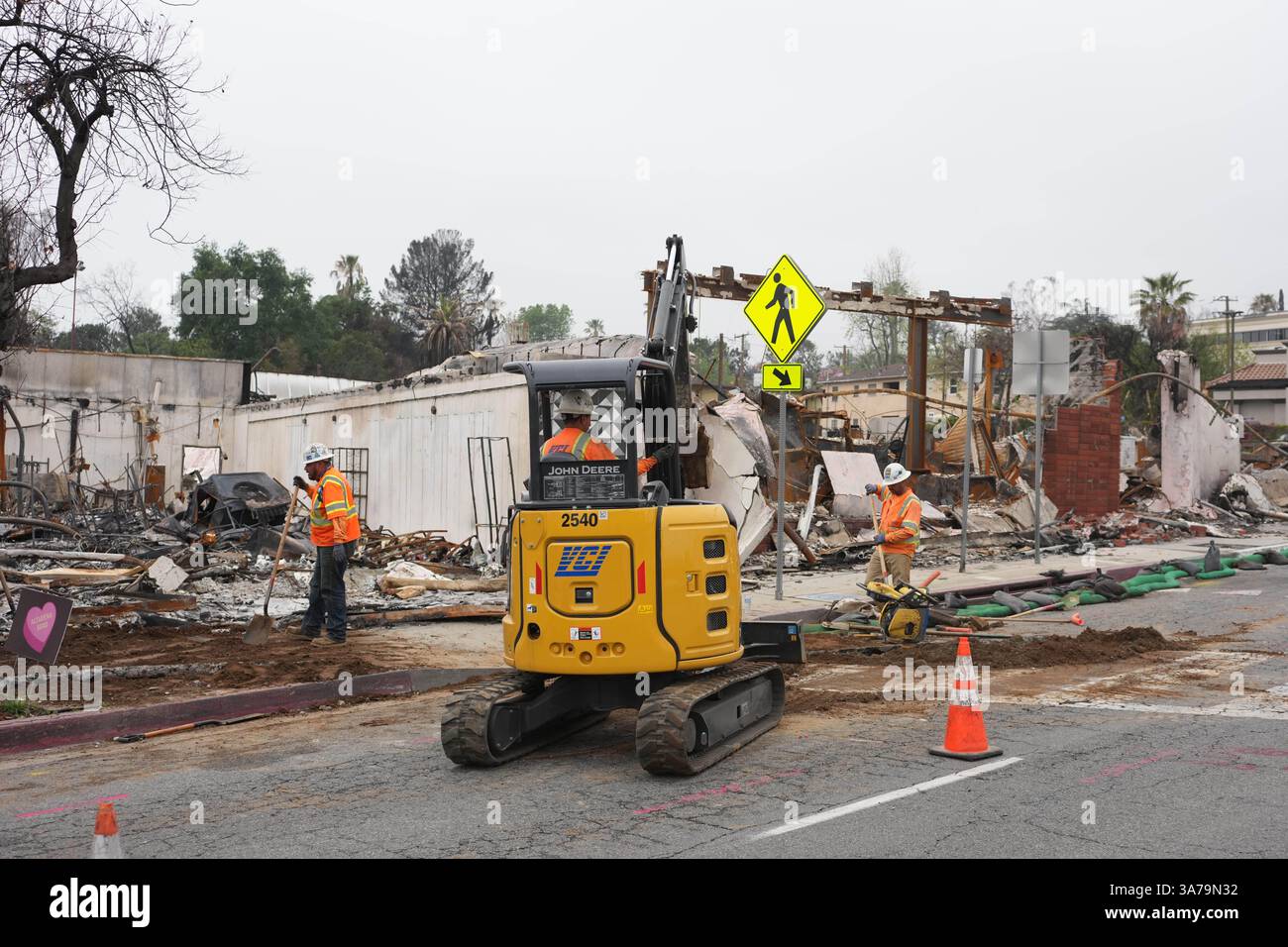 VCI Construction workers clear the Eaton fire burned property of the ...