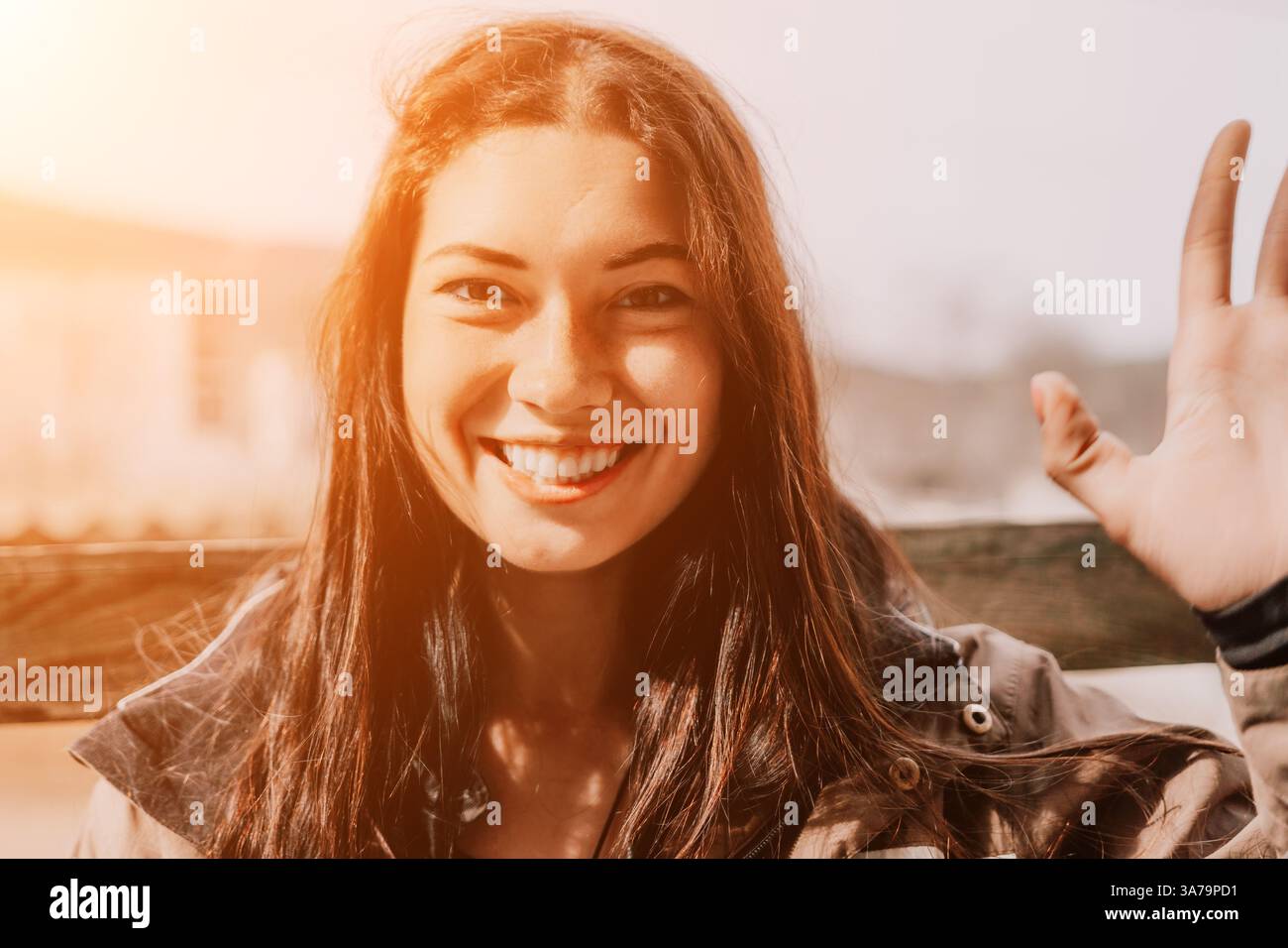 Friendly smiling girl waving hand hi-res stock photography and images - Alamy